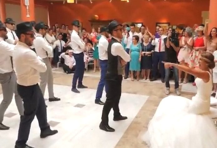 Groomsmen line up to dance for the bride- Little brother steals the show