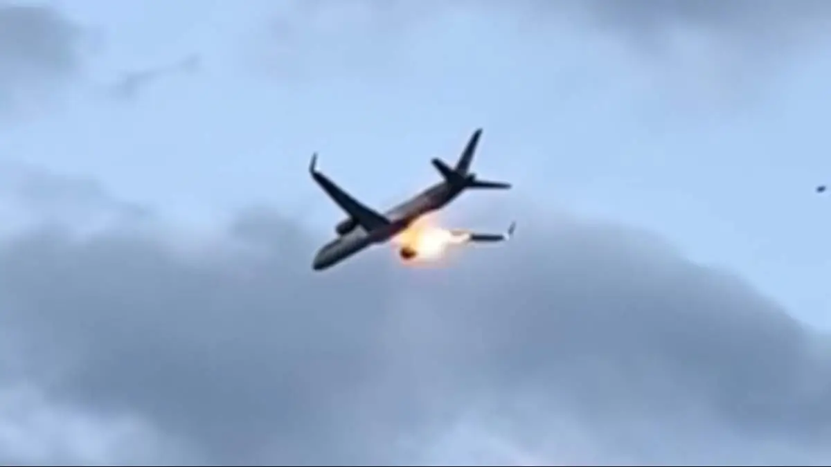 Shocking footage captures flames bursting from a plane's engines as terrified passengers ...